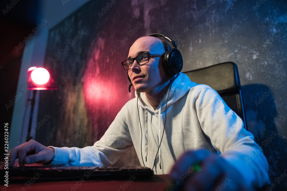 Professional Boy Gamer Plays in Video Game on a eSports Tournament or ...