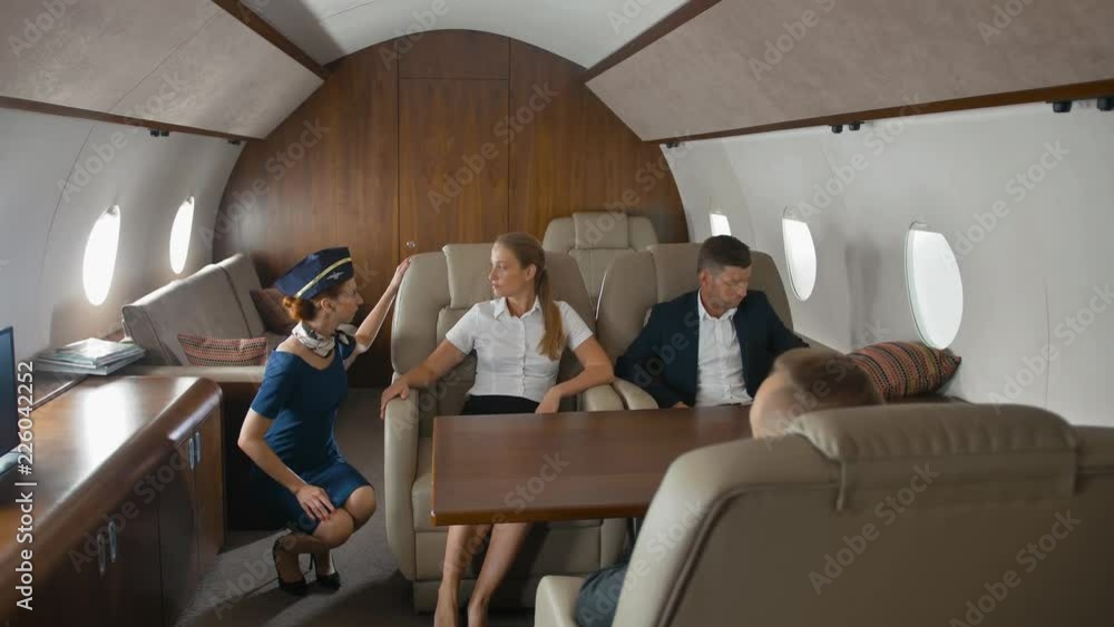 Video „Pretty stewardess offers help and service for luxury private jet ...