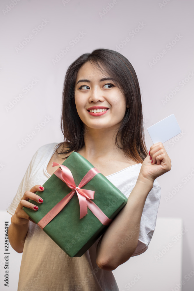 Asian young woman being happy to receive a gift box from her boyfriend ...