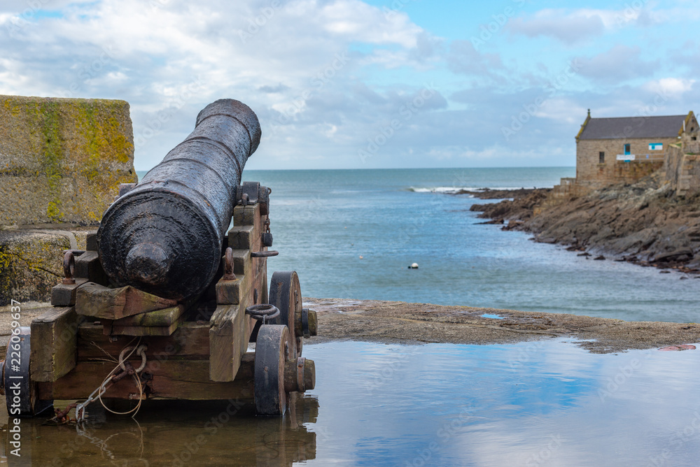 Cannon protect the harbour at Porthleven on Cornwall's south coast. The ...