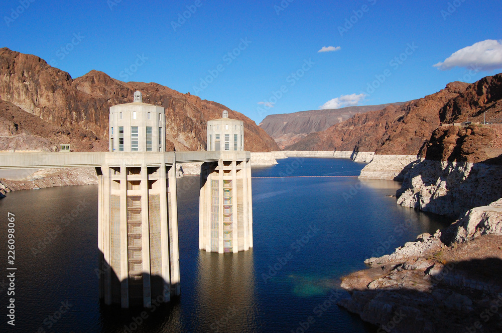Hoover Dam, once named as Boulder Dam, is located on the border between ...