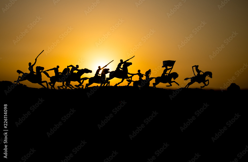 Attacking scene. War concept. Riders on horse ready to fight and ...