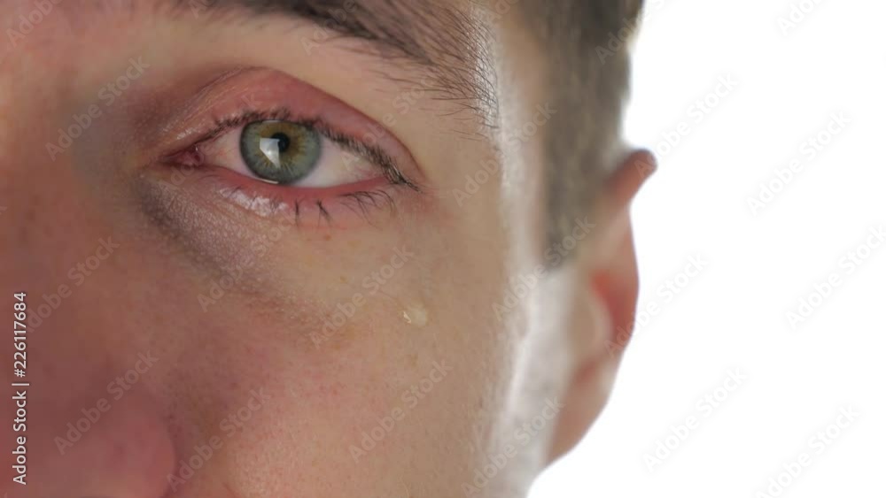 Vidéo Stock Half face portrait of sad man crying with tears in eye at ...