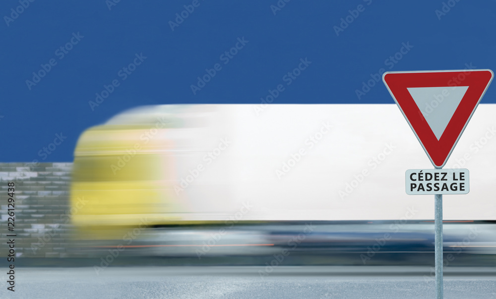Give way yield french cédez le passage road sign motion blurred truck ...