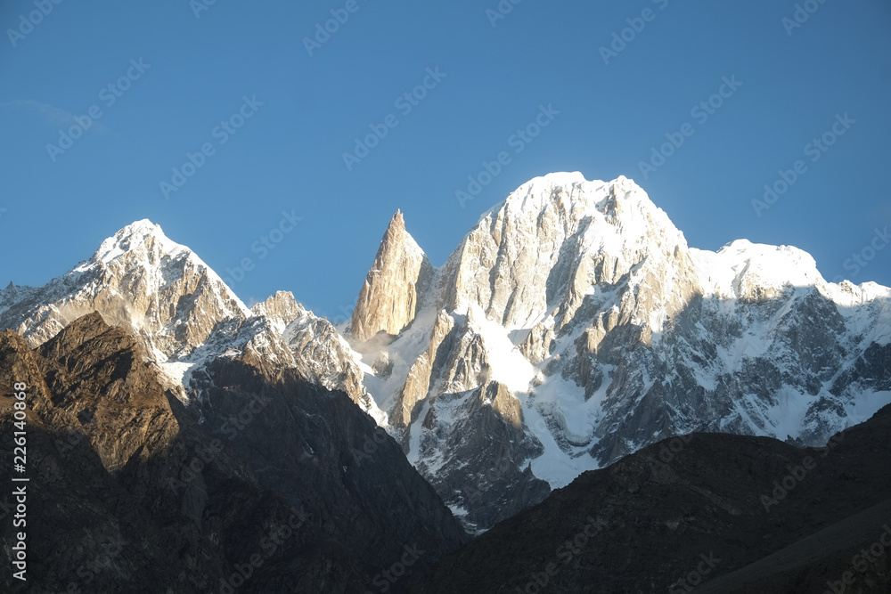 Snow capped mountains Lady's Finger and Hunza peak lit by morning ...