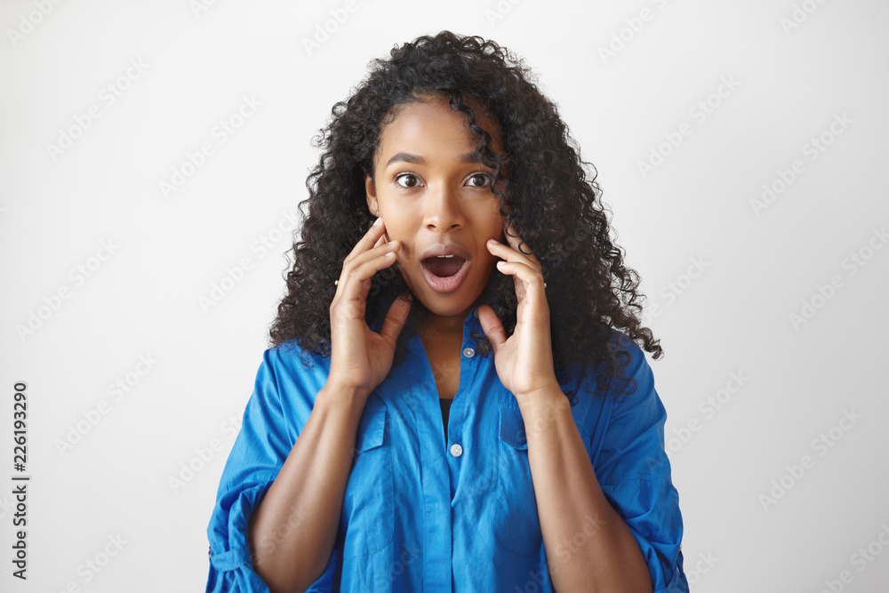 Portrait of funny fascinated young Afro American lady having stunned ...