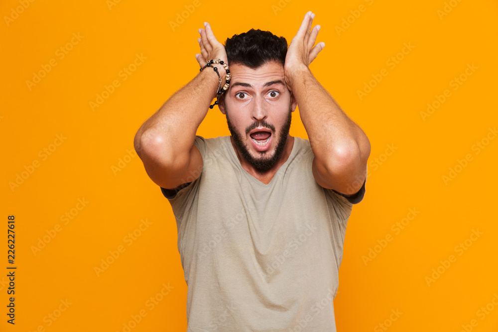 Portrait of a shocked young casual man Stock Photo | Adobe Stock