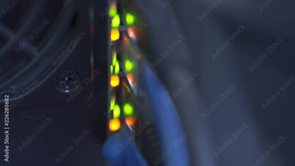 Network switch with indicator light and ethernet cables. Shot in 4k ...