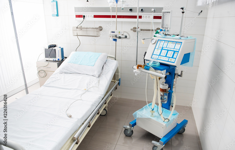 Waiting for patients. Modern and fully equipped recovery room in white ...