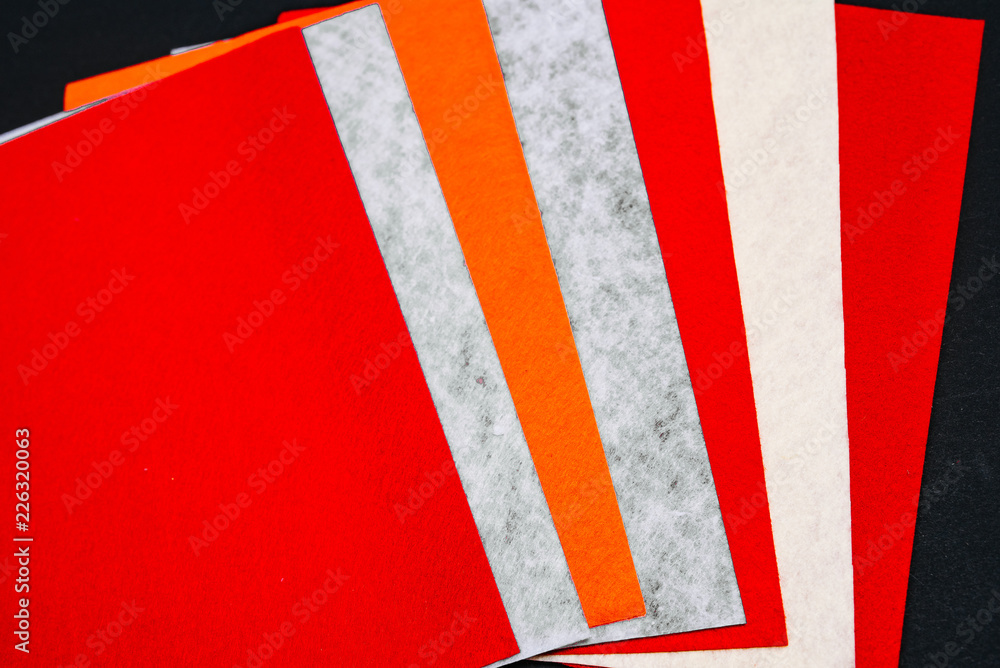 Red colored bright felt textile material. Samples of soft felt. Craft ...