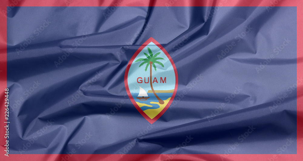 Fabric flag of Guam. Crease of Guam flag background, dark blue ...