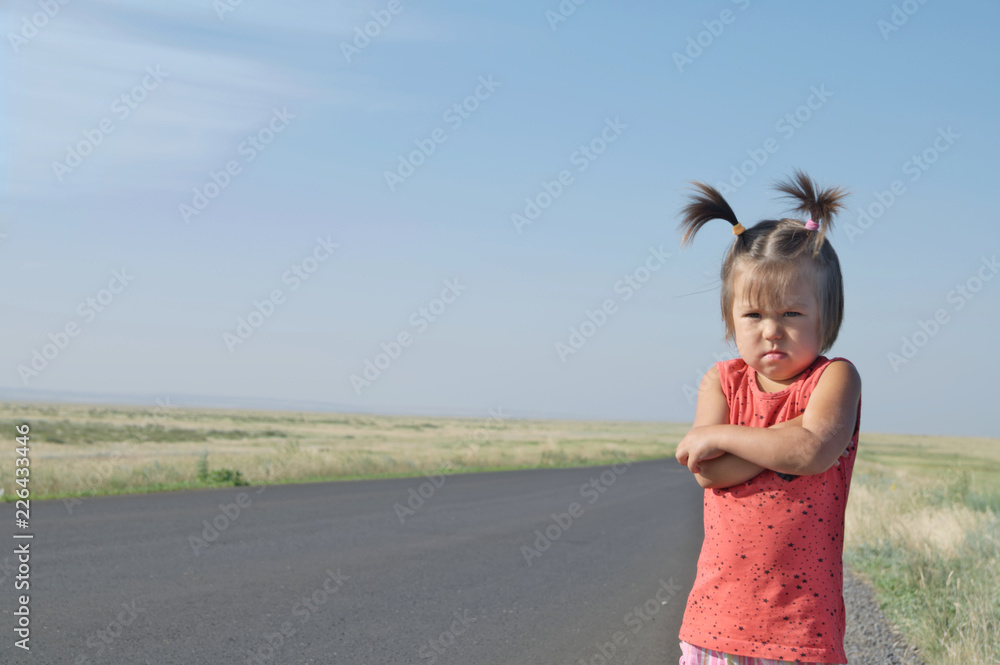 resentful child is standing and don't want to go anywhere defend own ...