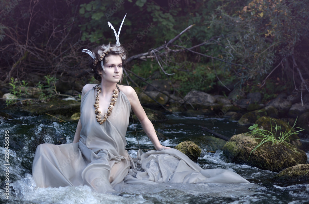 river nymph in a gray silk dress, a necklace of sea snail shells and a ...