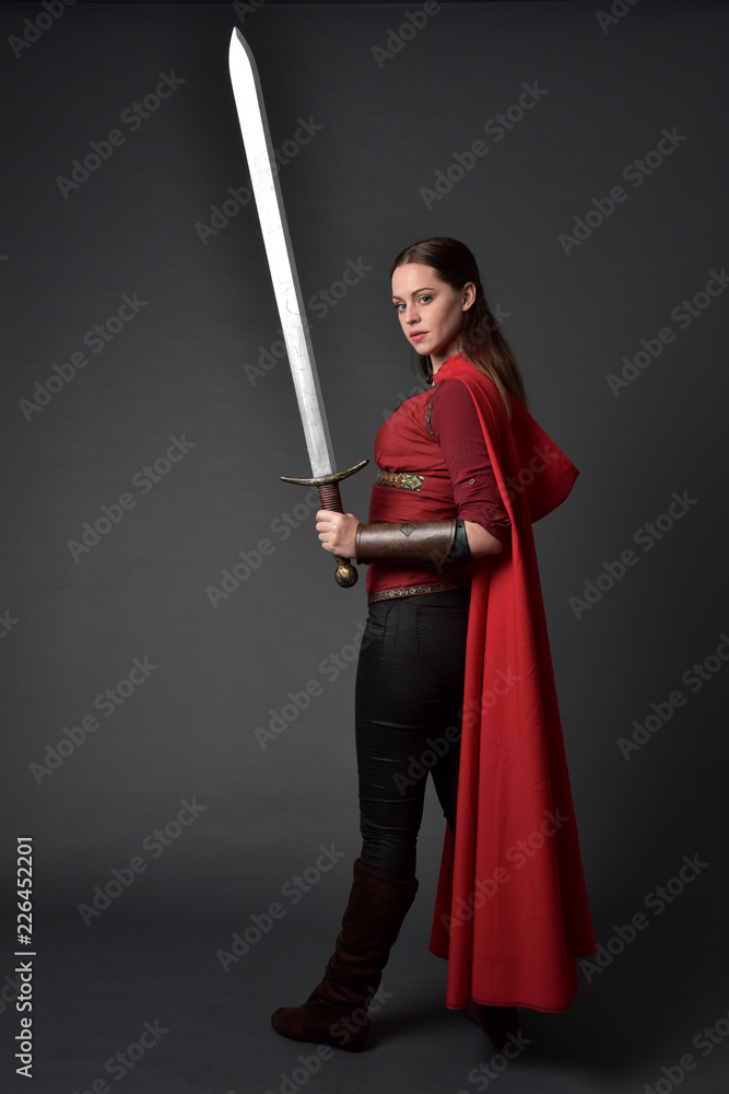 full length portrait of brunette girl wearing red medieval costume and ...