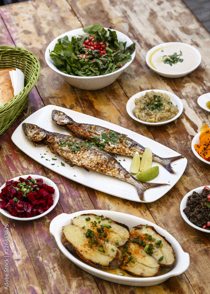 Food at a fish restaurant Acre (Akko), Israel. Stock Photo | Adobe Stock