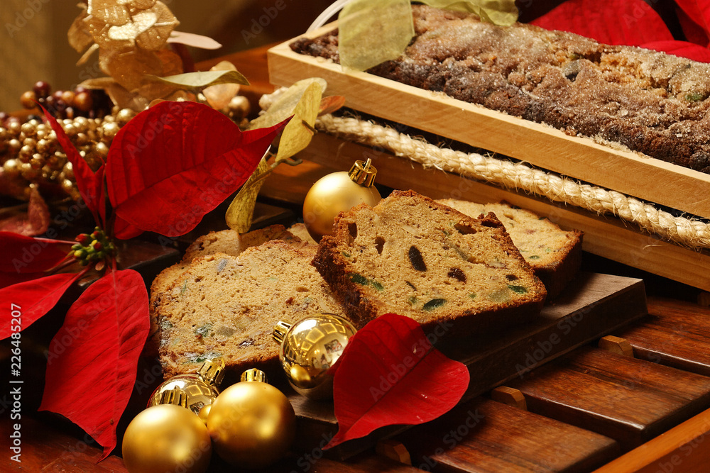 Christmas Panettone decorated with spheres, pines, and poinsettias ...