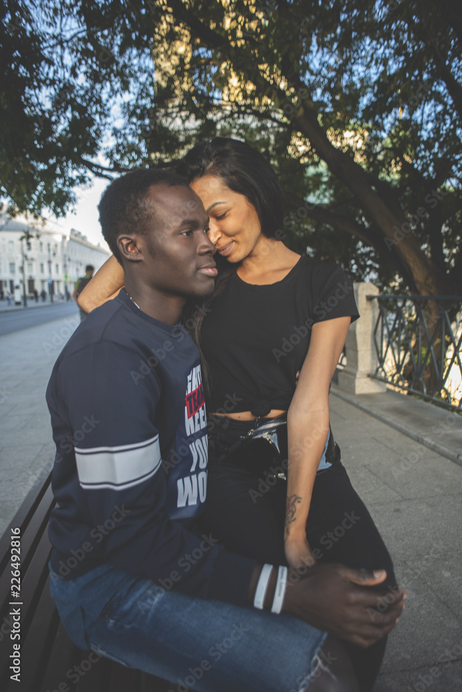 Lovely And Cool Mixed Races Couple In The Park Latino Woman And
