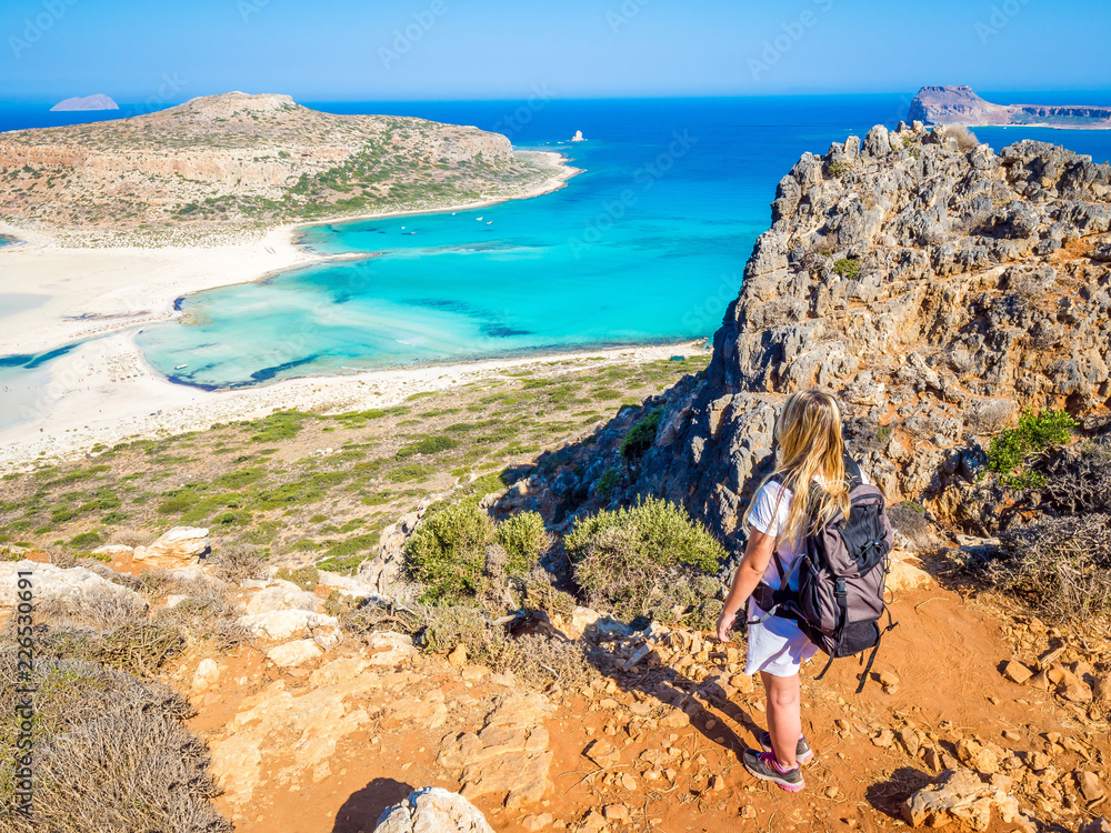 Crete, Greece: Blonde beautyful girl walking along the Balos beach with ...