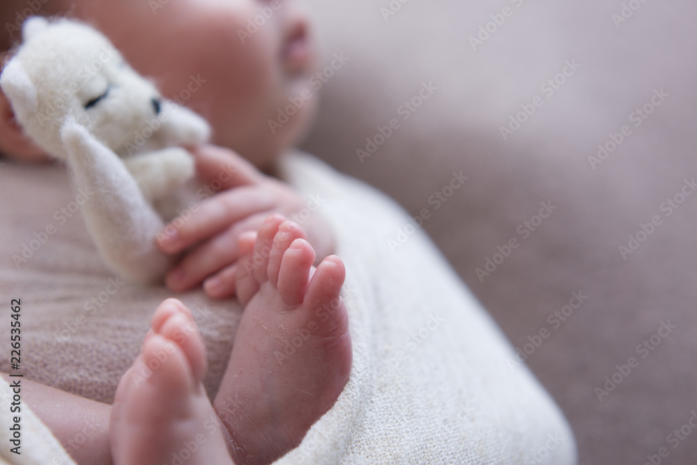 the legs of the newborn baby. the legs of the newborn flaky skin. peel ...