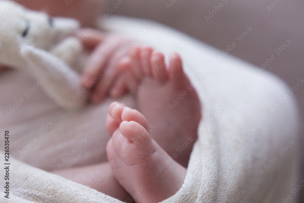the legs of the newborn baby. the legs of the newborn flaky skin. peel ...