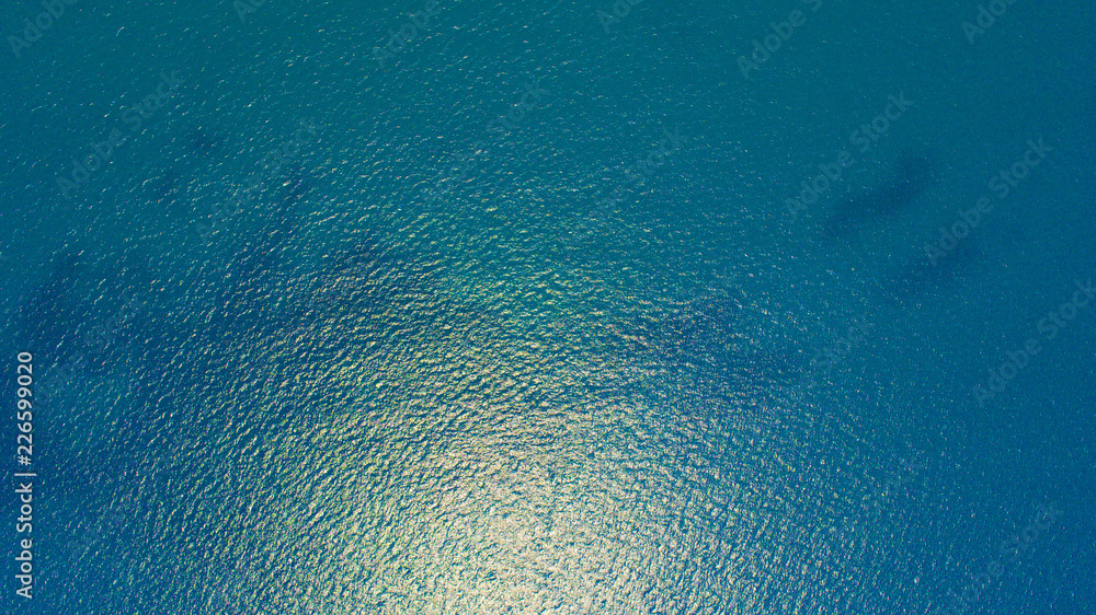 Poster Bird's eye view of sea ocean water surface texture background ...
