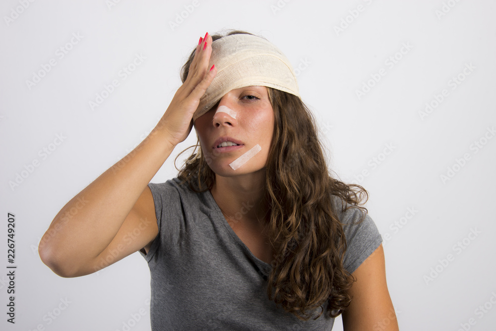 Foto de girl young woman with wounds and bandages head close up hurt ...