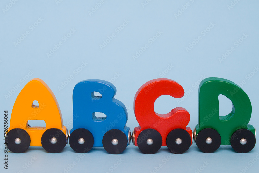 Letters A, B, C, D of a train alphabet with locomotive. Bright colors ...