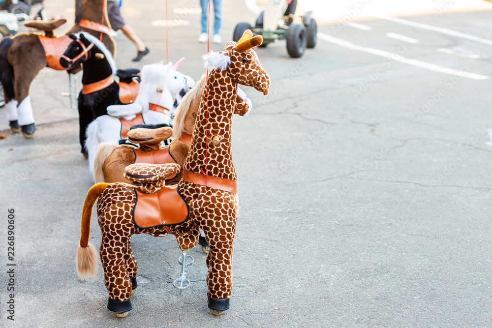 Group of large wheeled animal toys for riding. Children fun transport ...