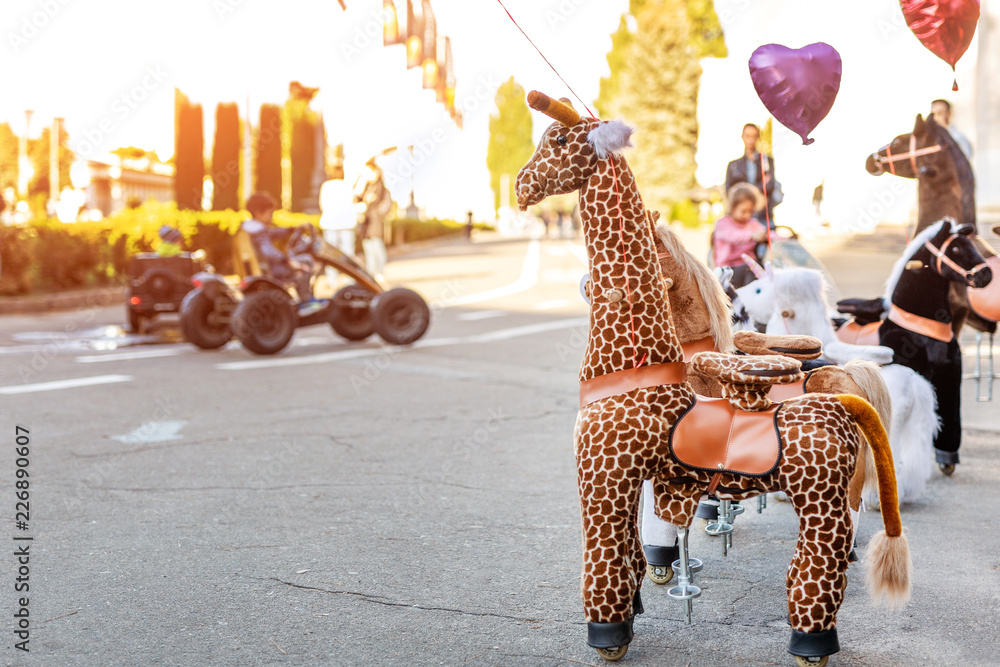 Group of large wheeled animal toys for riding. Children fun transport ...