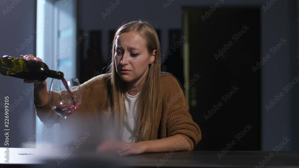 Lonely beautiful woman after divorce crying and drinking wine to ...