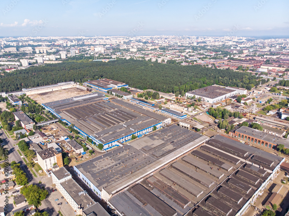 aerial view of urban industrial area with plants, forest and industrial ...