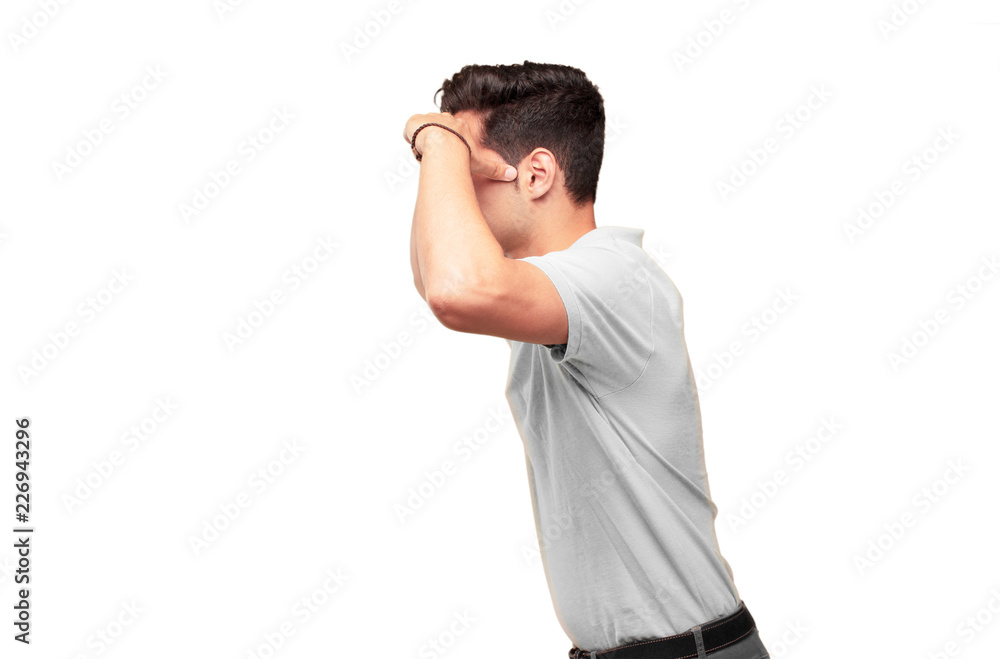 Young handsome tanned man looking far off into the distance, searching ...