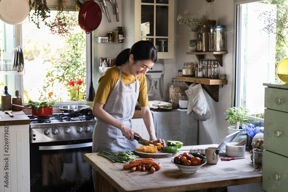 Japanese woman cooking in a countryside kitchen Stock Photo | Adobe Stock