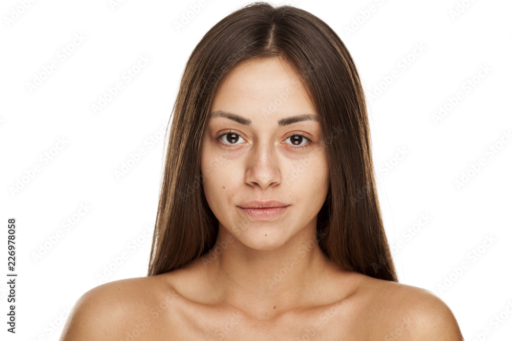 Portrait Of Young Beautiful Woman With No Makeup On White Backgeound