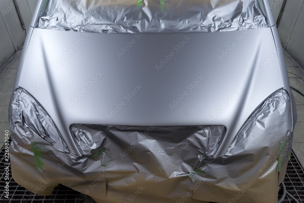 Full painting of a silver car in the back of a hatchback, some parts of ...