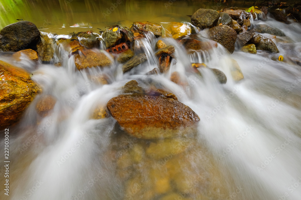 Continuous water flowing in the river of Ulu Bendul, Malaysia Stock ...