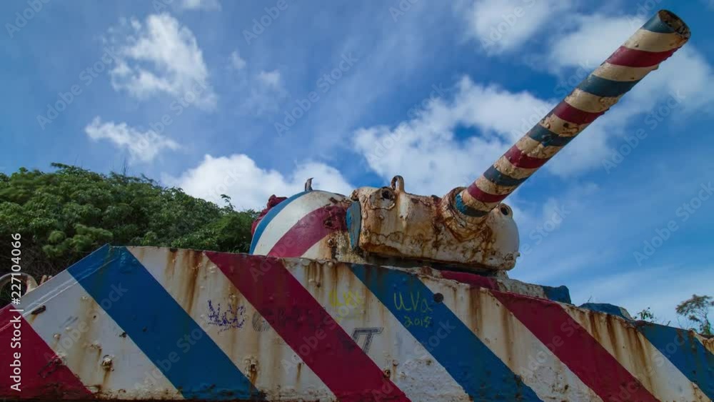 Time lapse hyperlapse of an old Sherman tank rusting in the water of ...