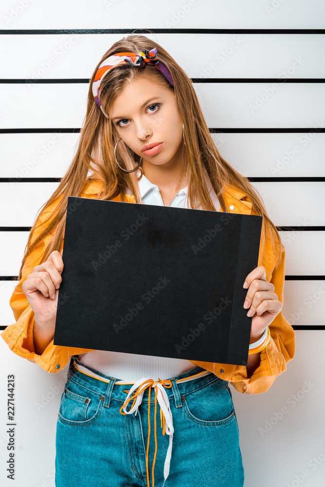 arrested stylish girl posing with empty prison board in front of police ...