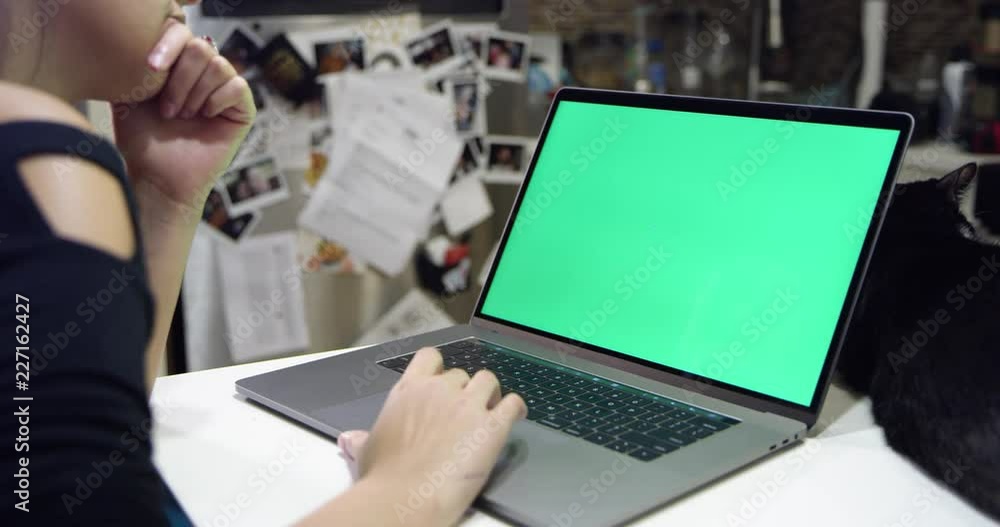 Woman using green screen laptop Stock Video | Adobe Stock