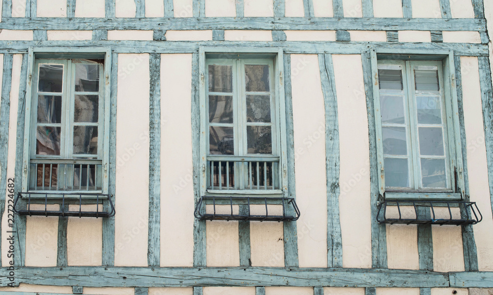 Facade of house in the old style. Typical old wall with wood beams and ...