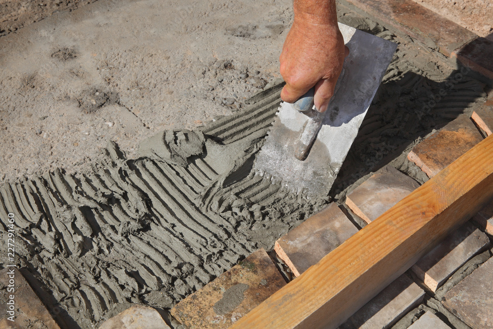 Old tiles recycling, making terrace or pavement using tile pieces ...