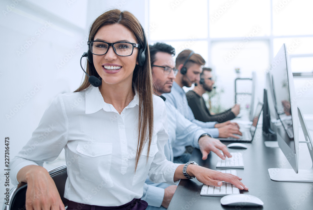 smiling call center employee works in a modern office Stock Photo ...