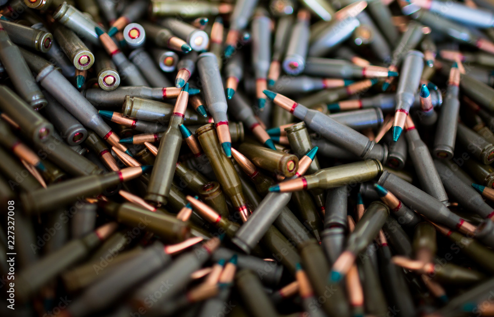 5.56mm rifle bullet. Army supplies. Military war background. Ammo Stock ...