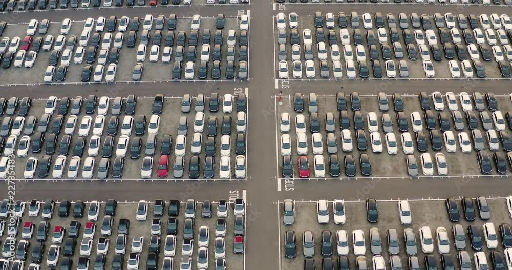 Aerial view of a new car depot, where you can see thousands of cars ...