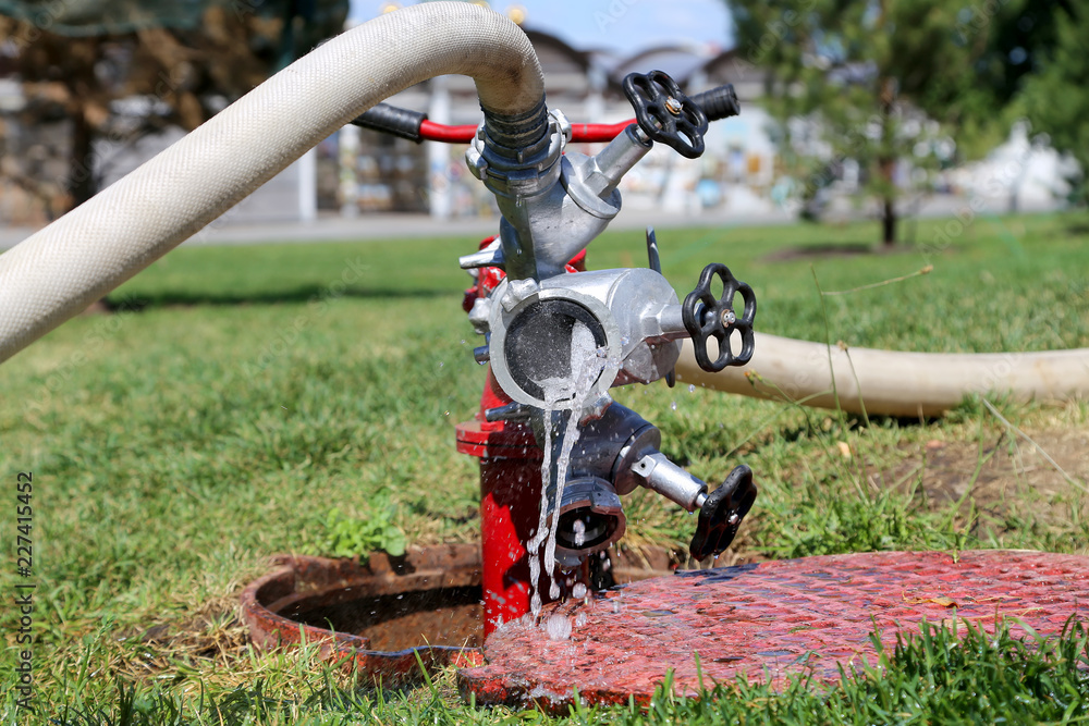 water flow coming out from a fire hydrant Stock Photo | Adobe Stock