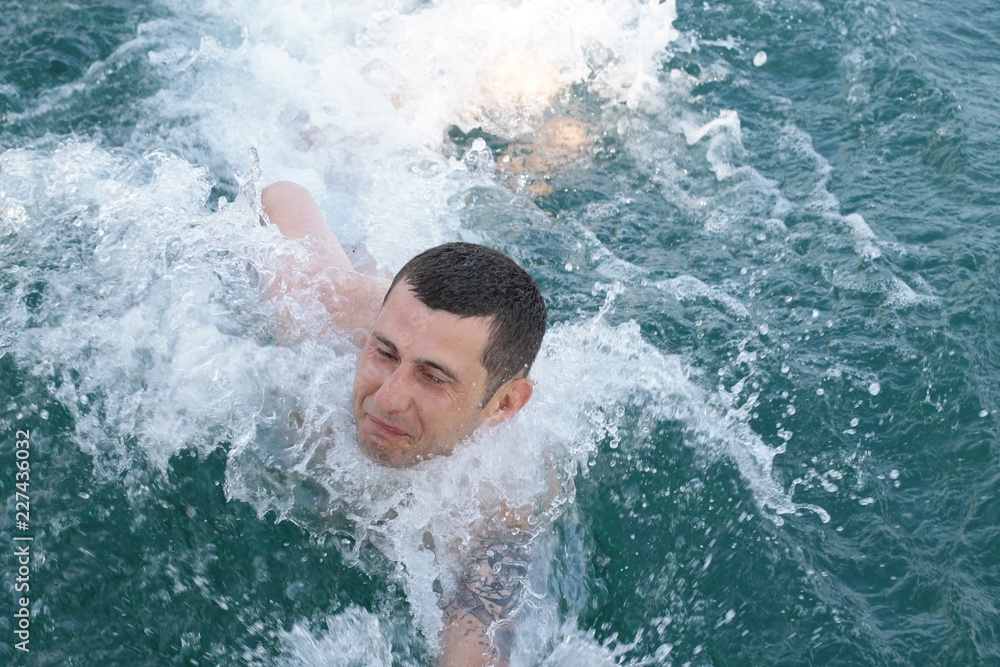 boy in swimming sea Stock Photo | Adobe Stock