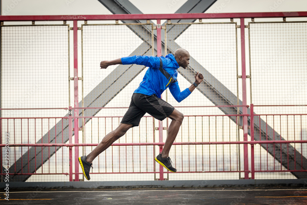 Man running at pedestrian walkway Stock Photo | Adobe Stock