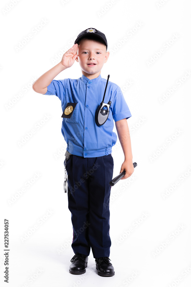 Cute little police boy with smile on face and gun on white background ...