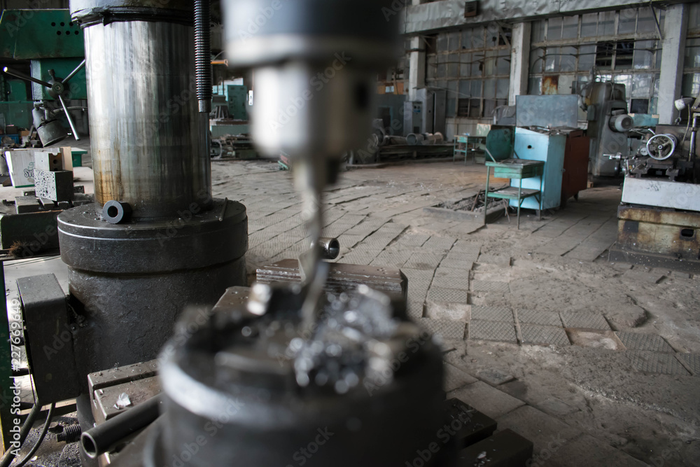 Drilling machine turning works metalworking production drill closeup ...