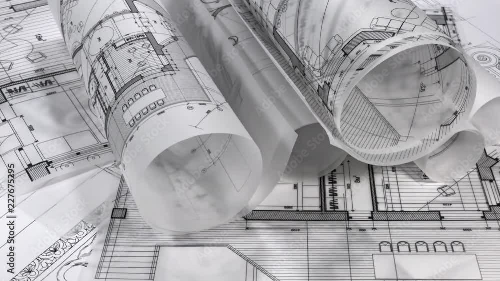 Blueprints - rolls of architectural drawings smoothly rotate on the ...